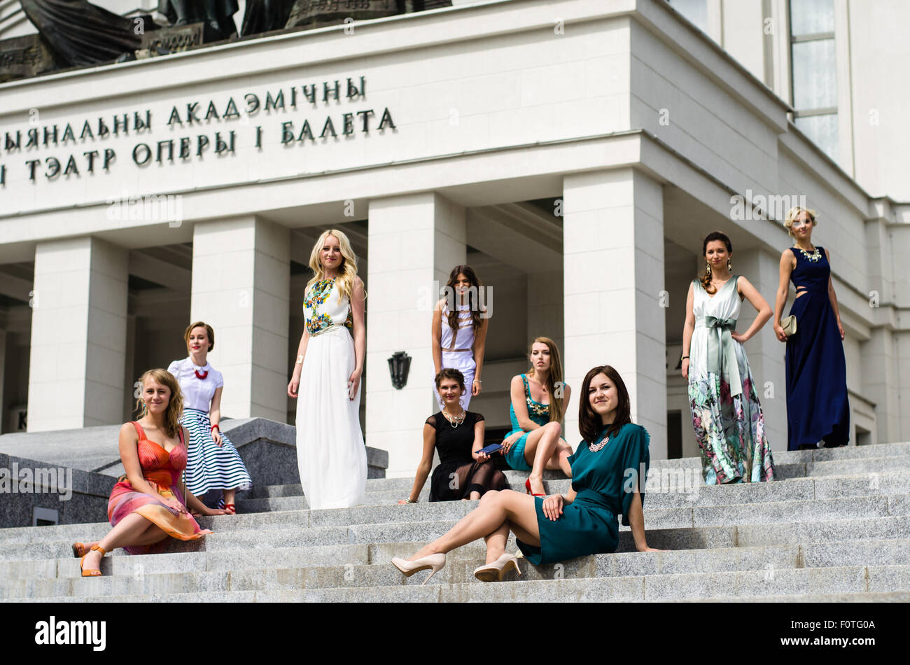 A big group of girls (females) posing in a front of a camera before ...