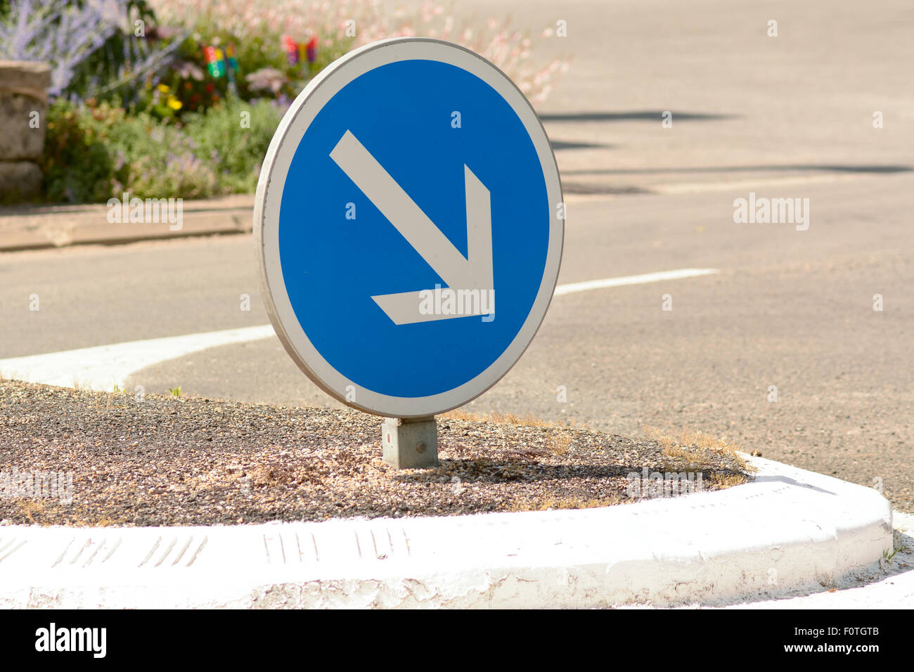 Direction arrow road sign at junction Stock Photo - Alamy