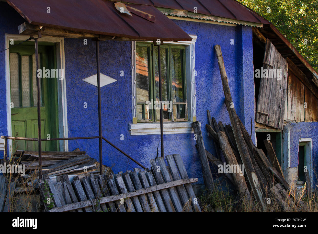 Colourful abandoned houses in the village of Isverna. Mehedinti Plateau ...