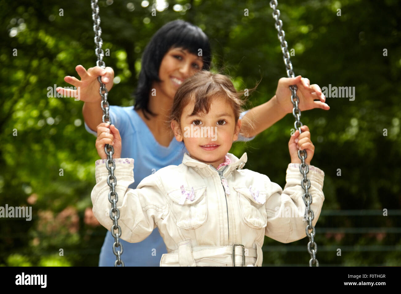 Child swing push hi-res stock photography and images - Alamy