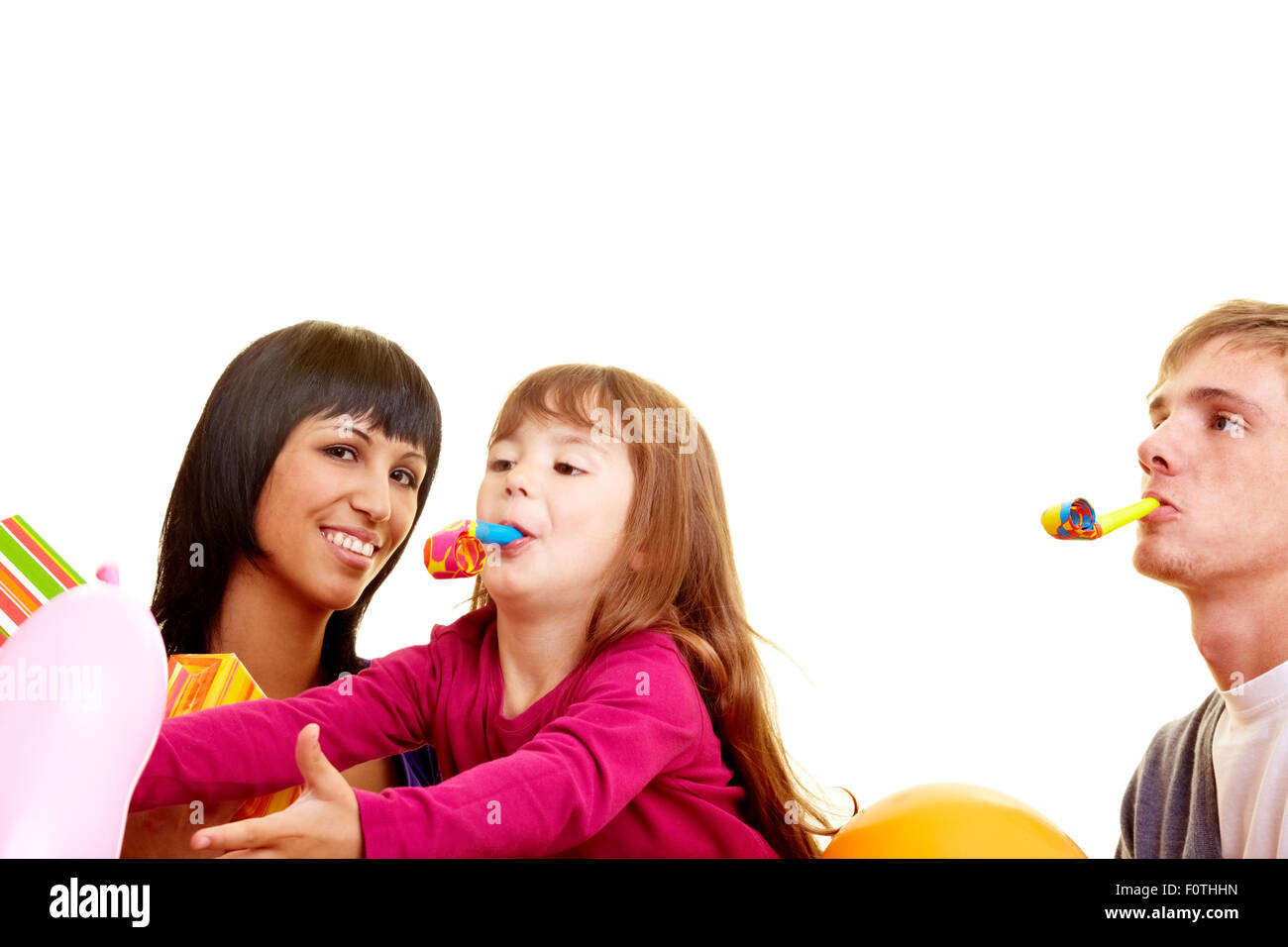 Parents celebrating a birthday with their daughter Stock Photo - Alamy