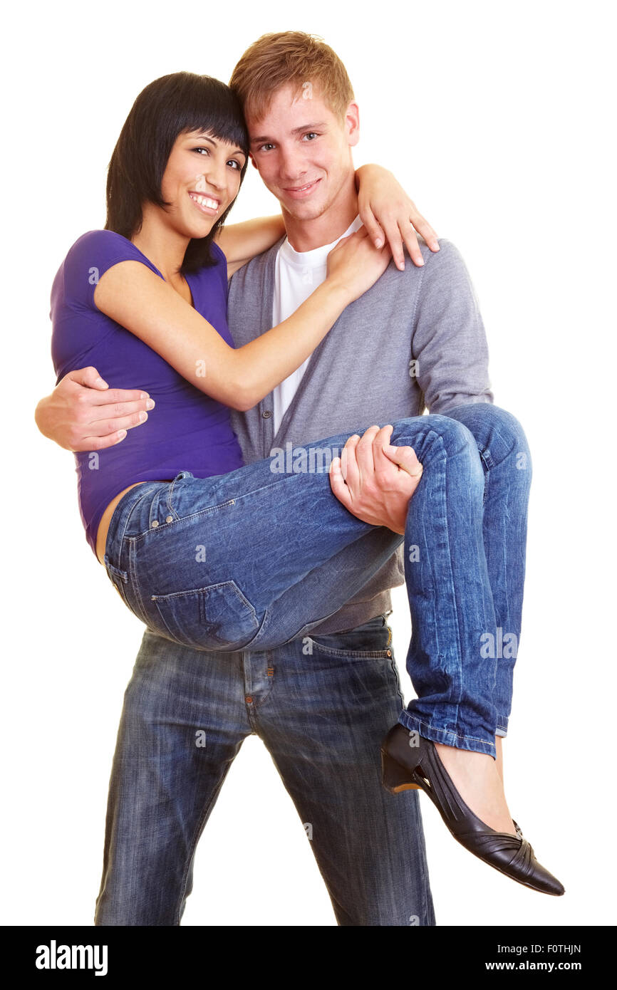 Young man carrying his girlfriend on his hands Stock Photo - Alamy