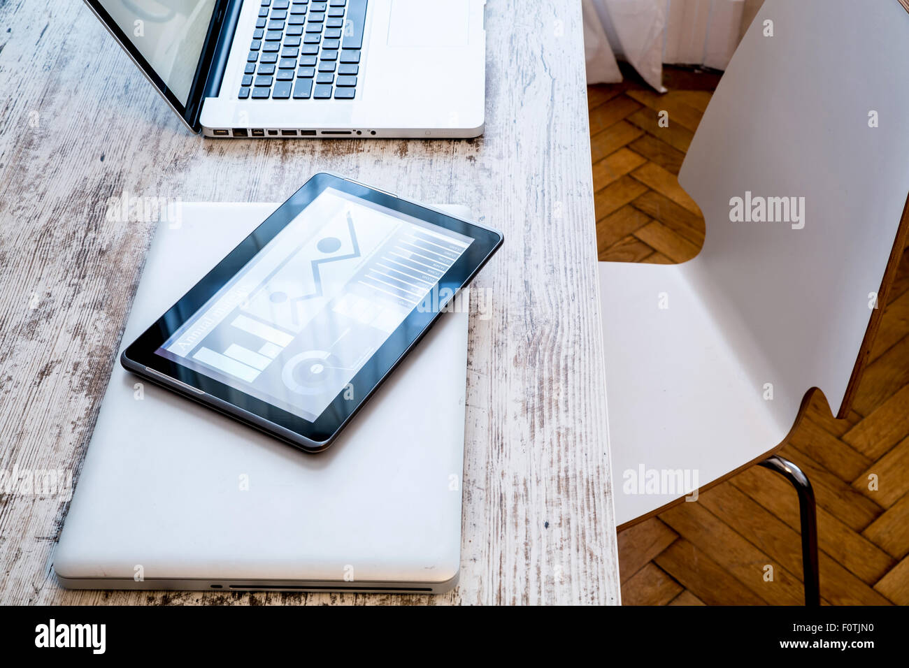 A office setup with a Laptop computer and a Tablet PC Stock Photo - Alamy
