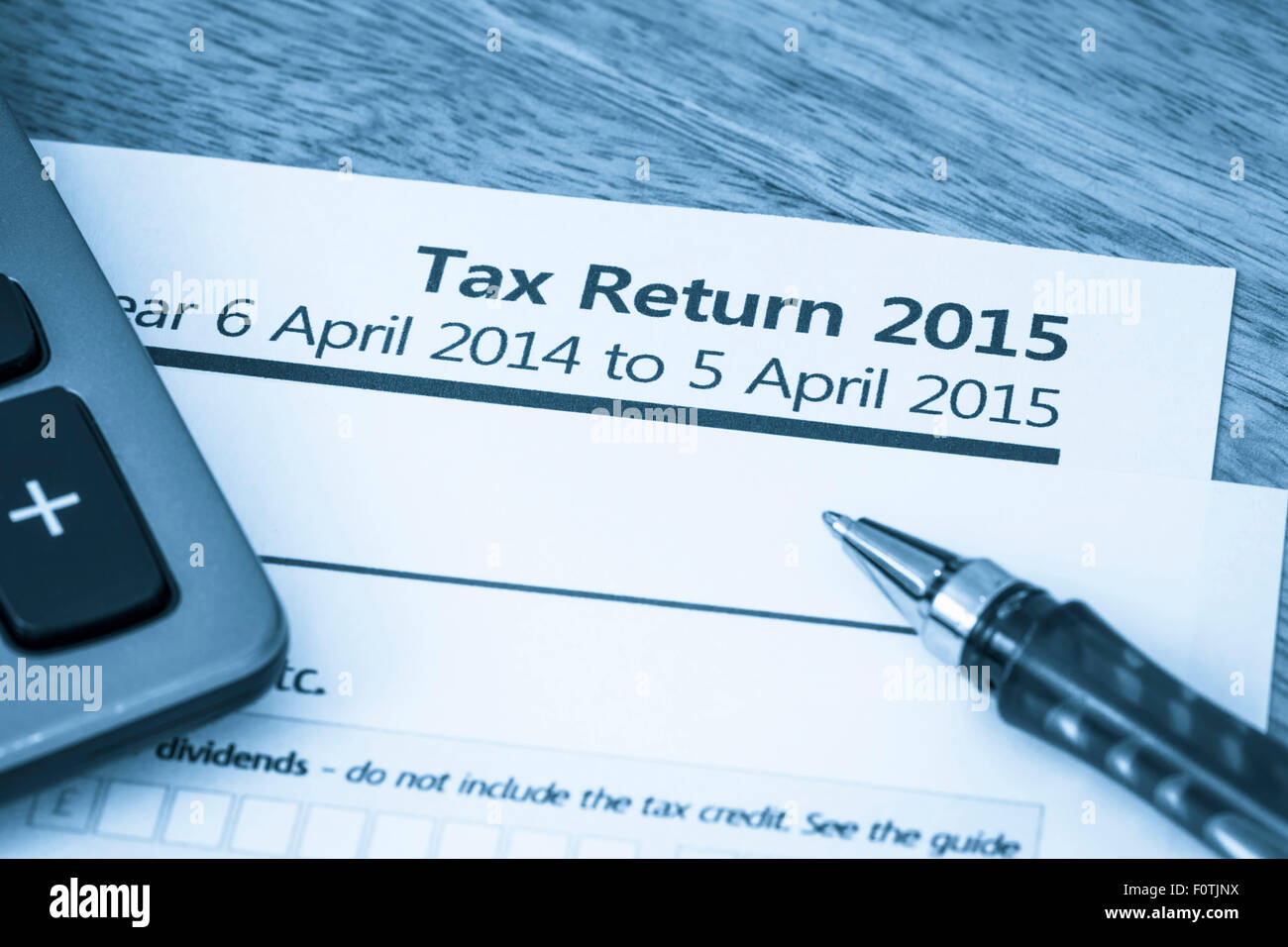 Cool toned image of UK income tax return form for 2015 Stock Photo - Alamy