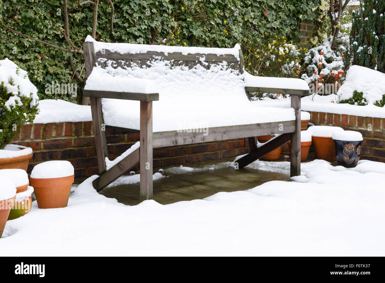 Bench in suburban garden hi-res stock photography and images - Alamy