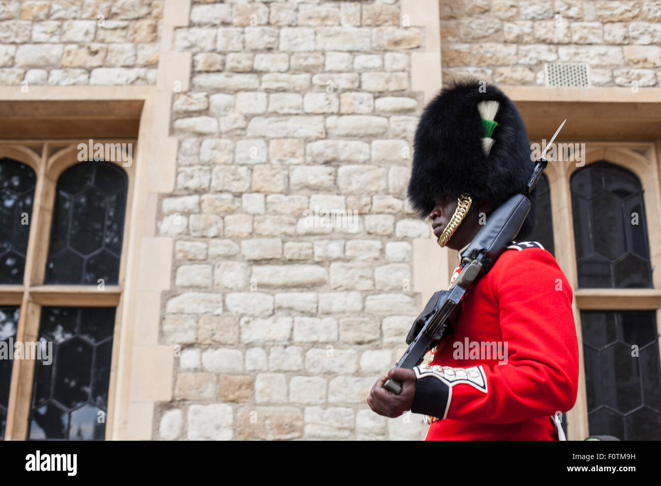 A Royal Guard soldier stands at the Tower of London with rifle and ...