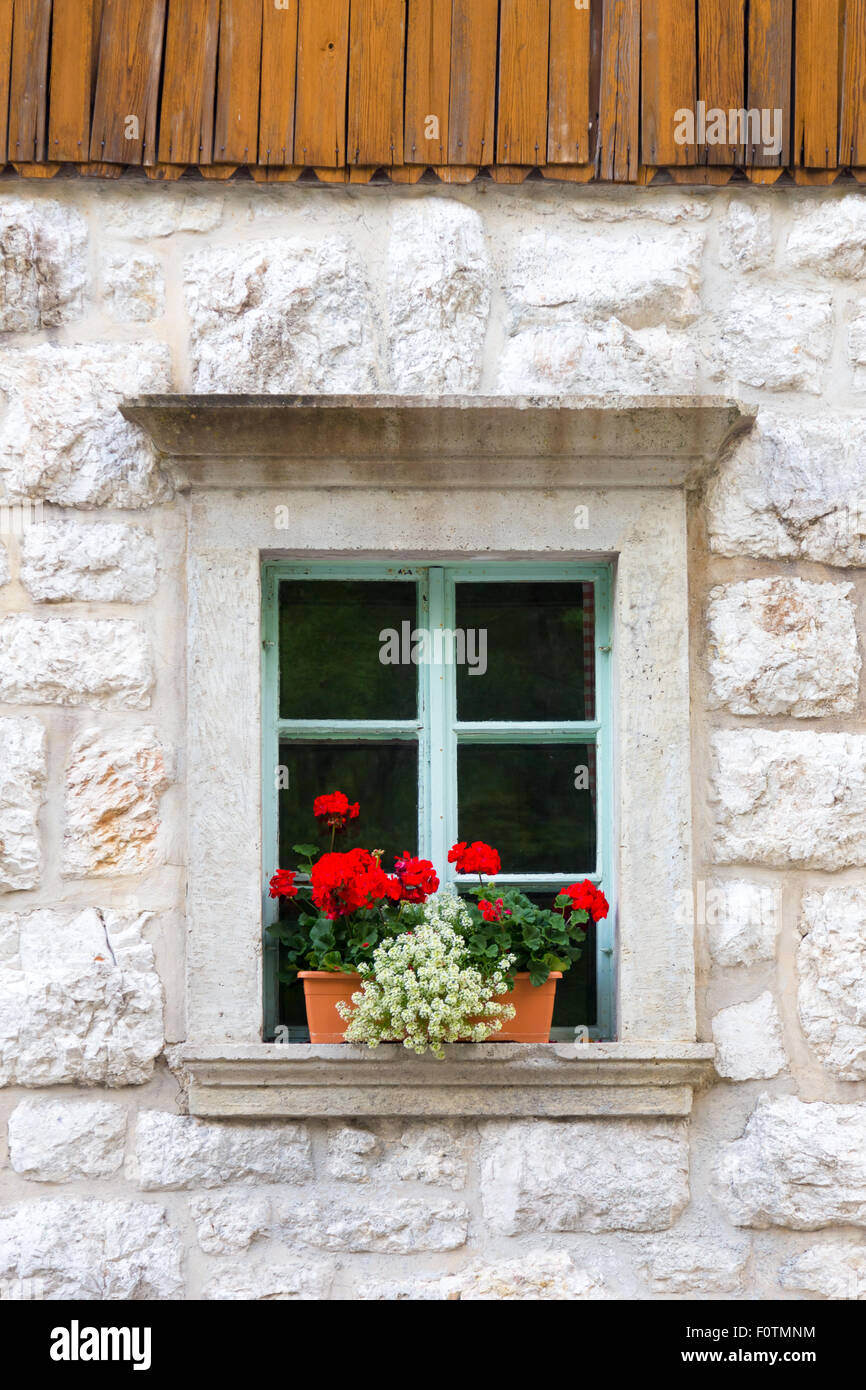 Traditional alpine stone window Stock Photo - Alamy
