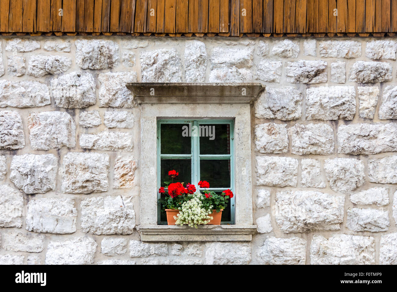 Traditional alpine stone window Stock Photo - Alamy