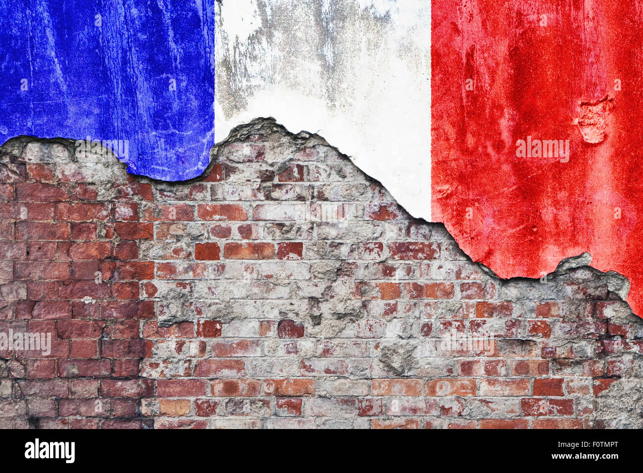France wall. Grungy old brick wall with French flag on broken render ...