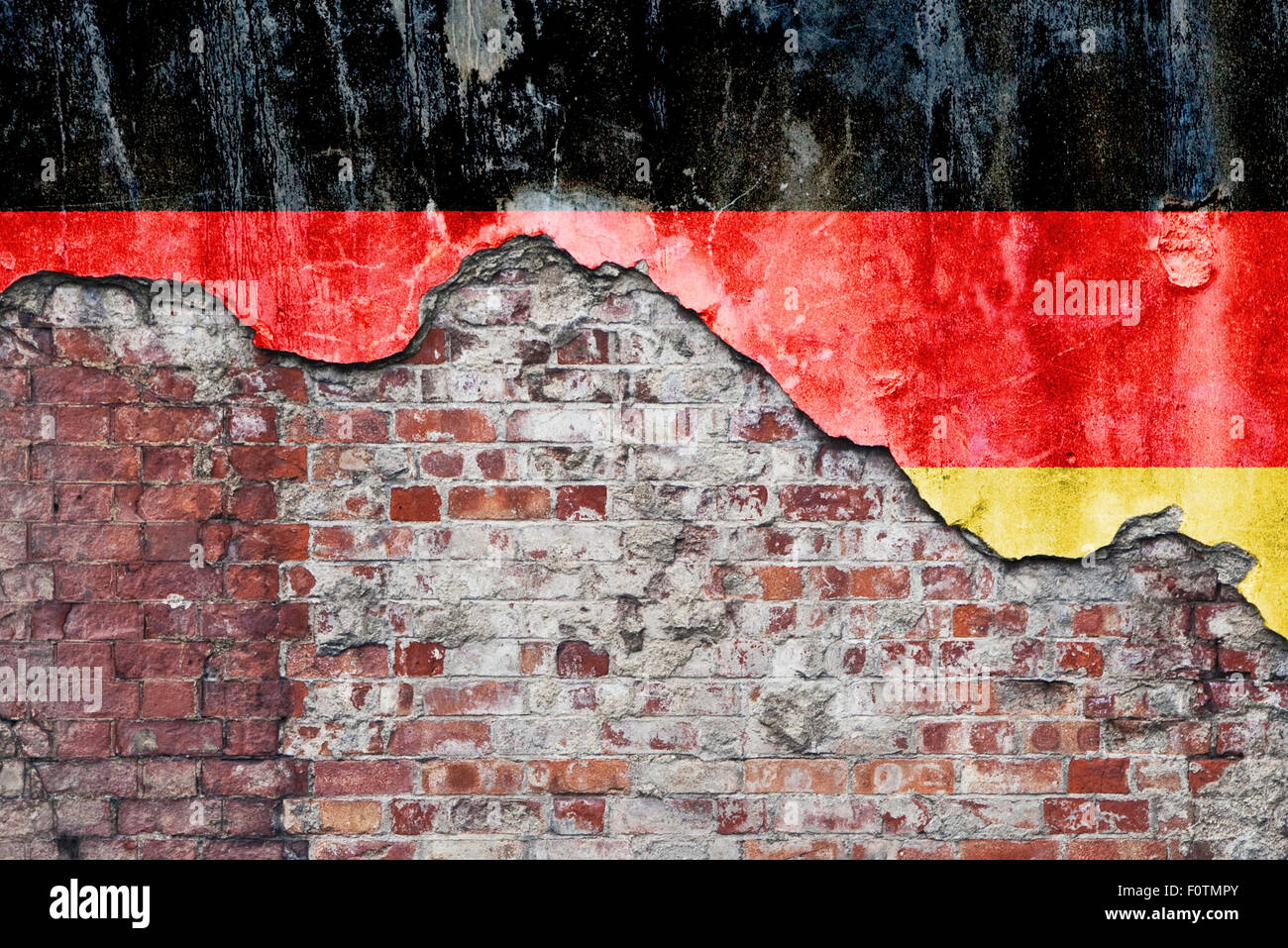 Germany wall. Grungy old brick wall with German flag on broken render ...