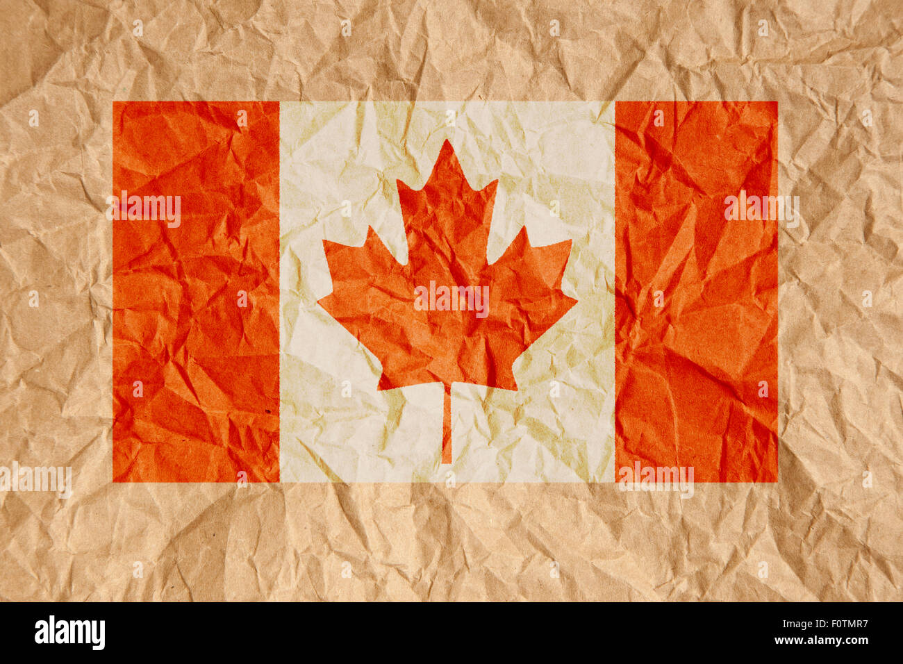 Canada flag. Canadian flag on crumpled brown paper background Stock ...