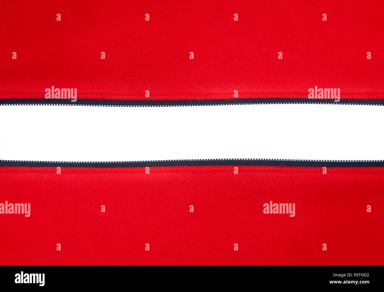 Open horizontal zipper on red material against white background Stock ...