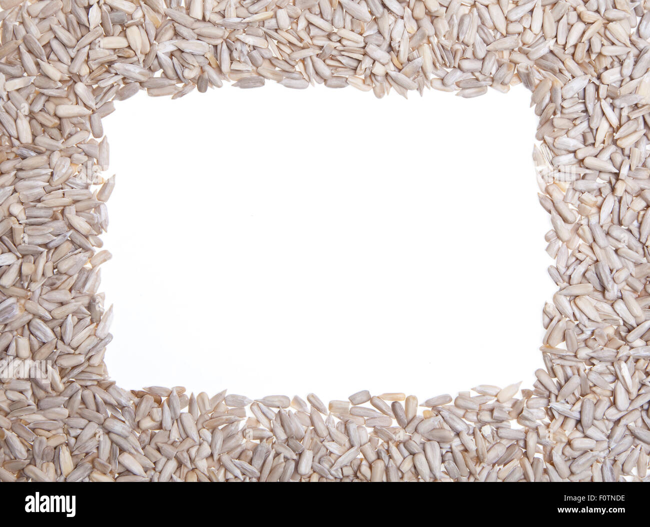 Healthy sunflower seeds framing a white background Stock Photo - Alamy