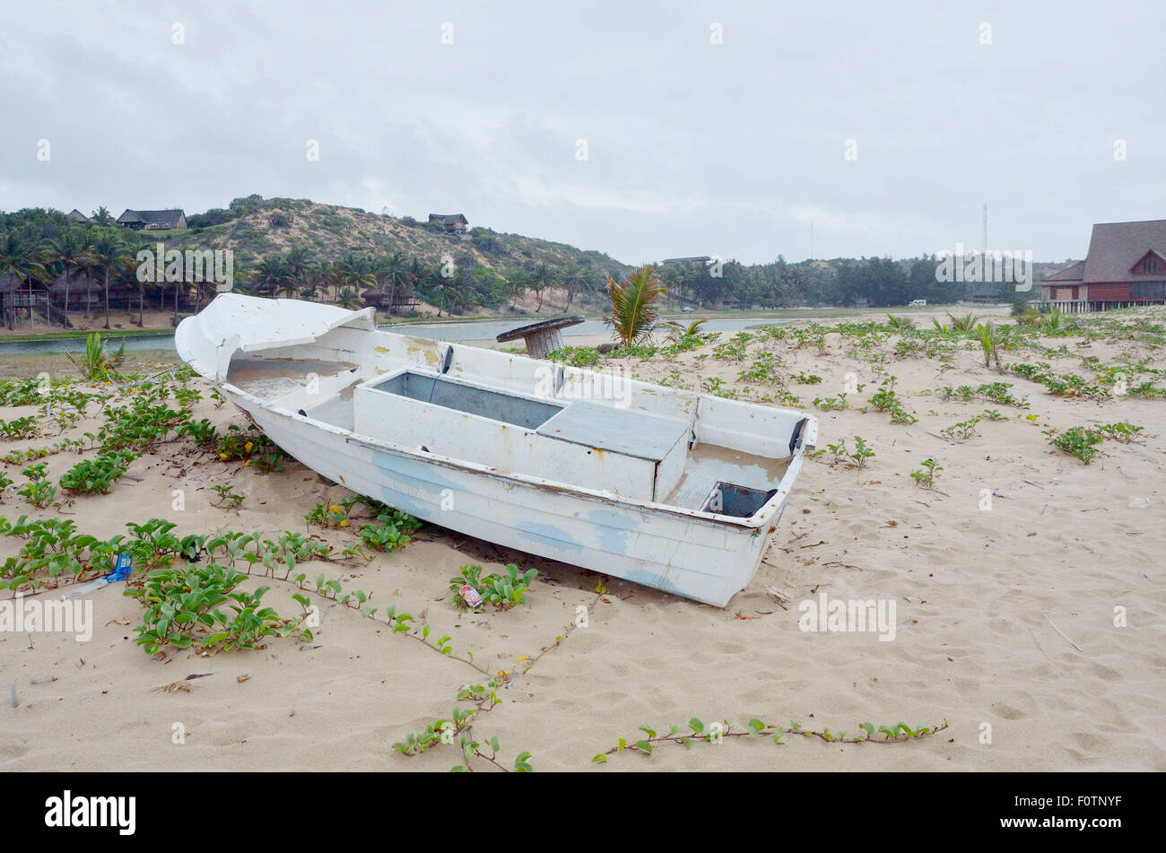 This old, unsafe fishing boat lying on the beach at Inhambane ...