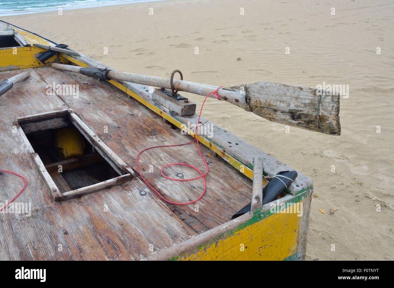 This old, unsafe fishing boat lying on the beach at Inhambane ...