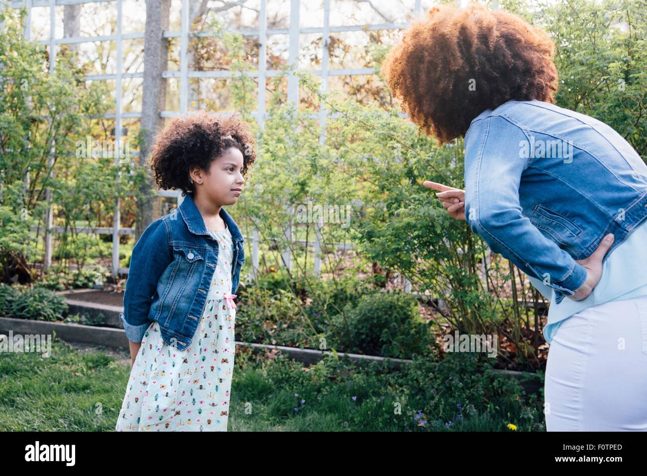 Mother scolding girl, hand on hip, pointing finger Stock Photo - Alamy