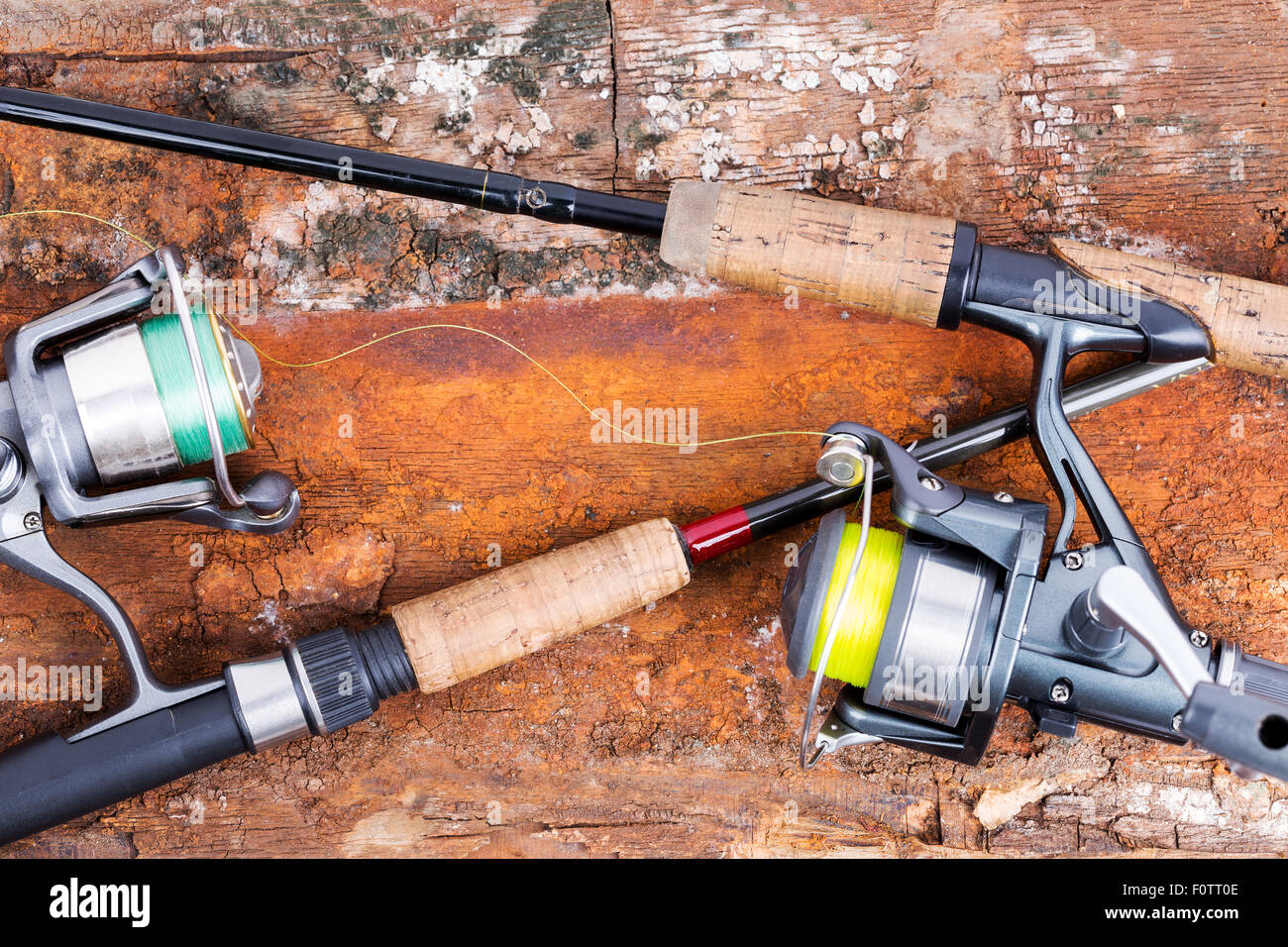 fishing rod and reel with line on natural background for frame, print ...