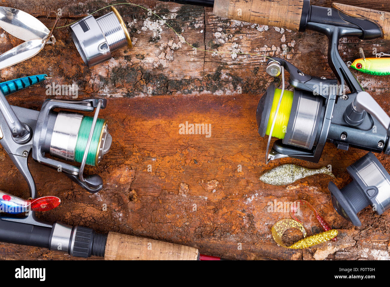 fishing rod and reel with line on natural background for frame, print ...