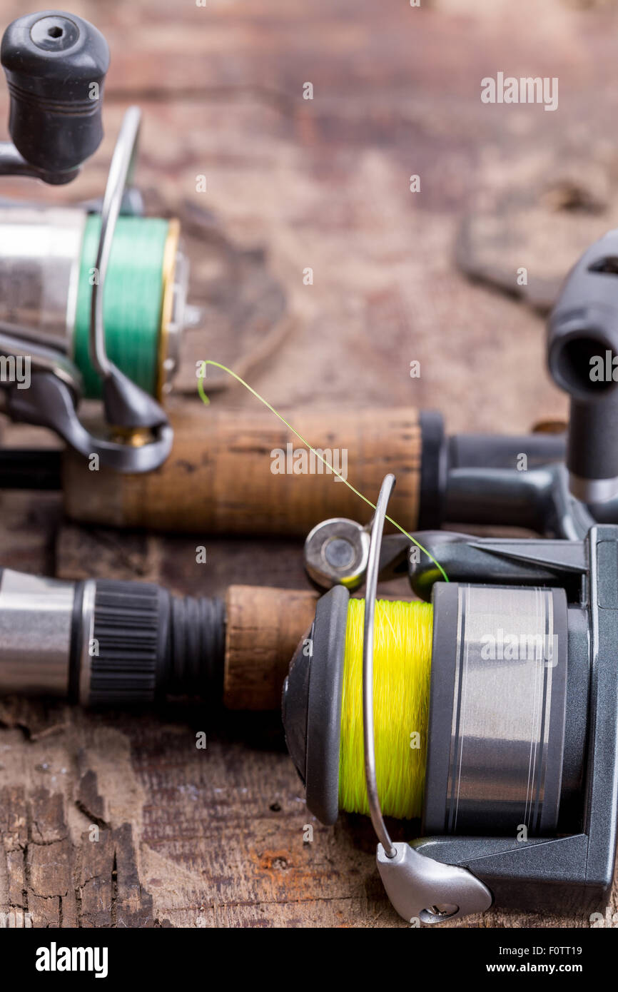 fishing rod and reel with line on natural background for frame, print ...