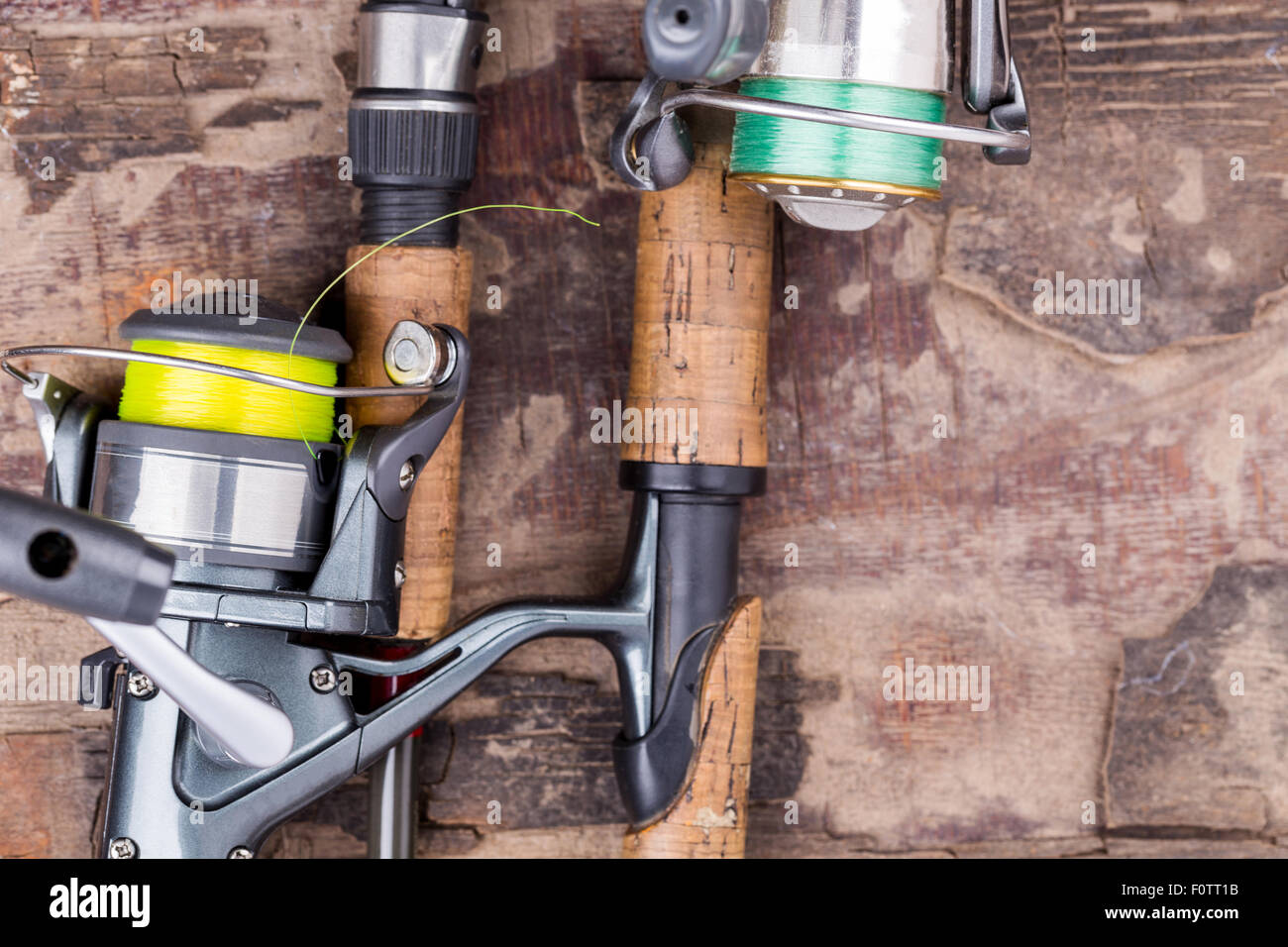 fishing rod and reel with line on natural background for frame, print ...