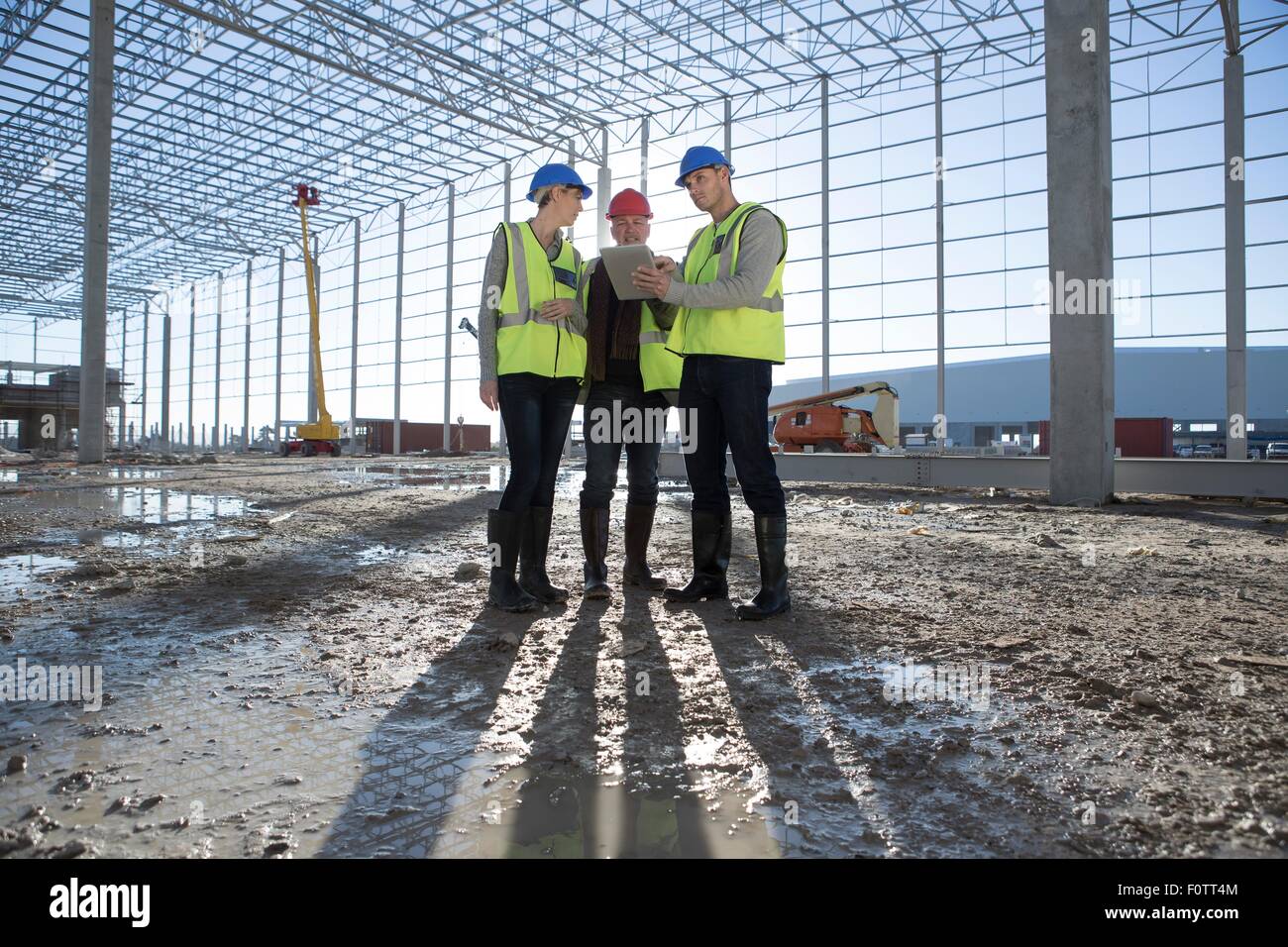 Architect and builders meeting on construction site Stock Photo - Alamy