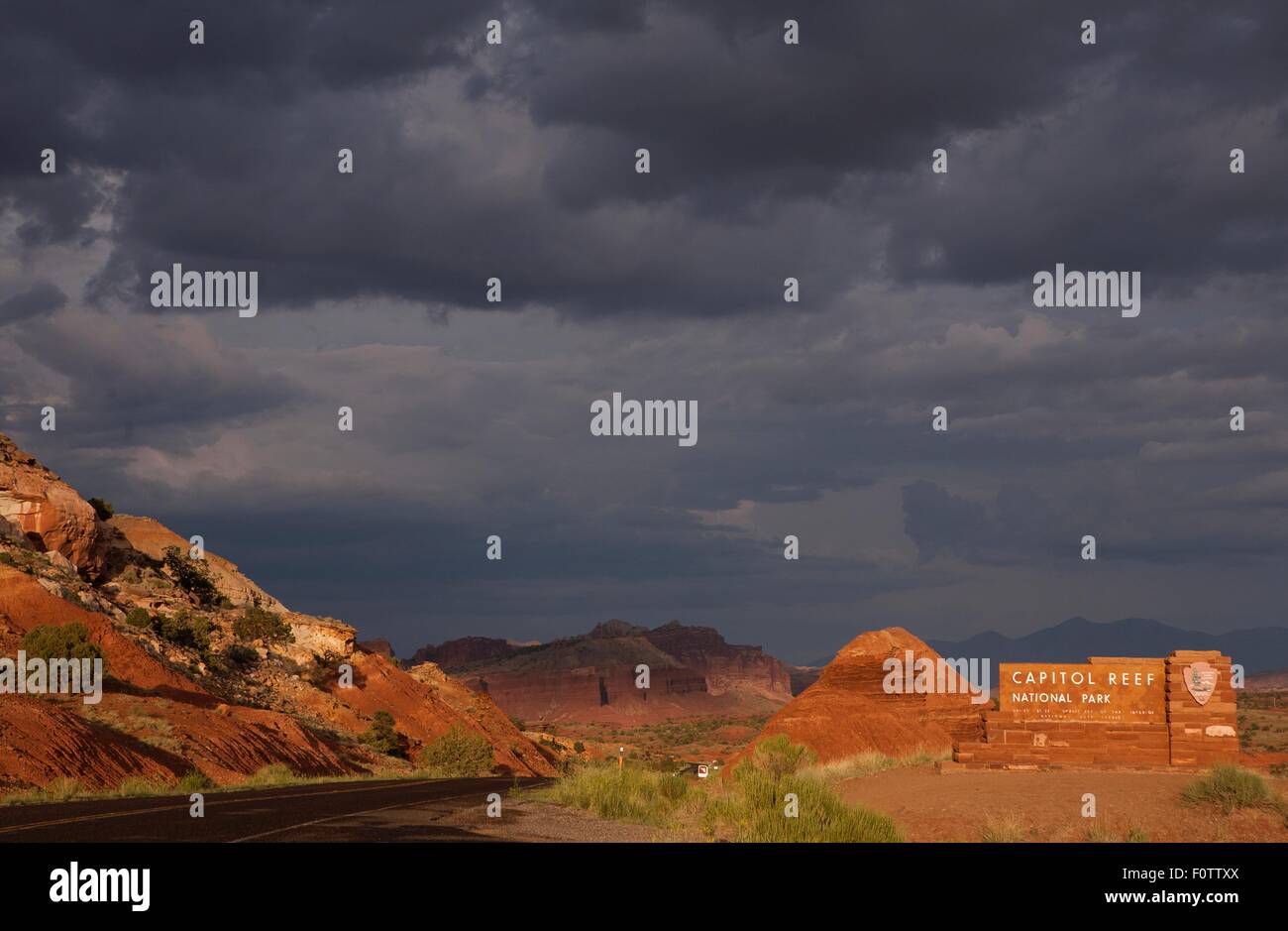 View of location sign and storm clouds in Capitol Reef National Park ...