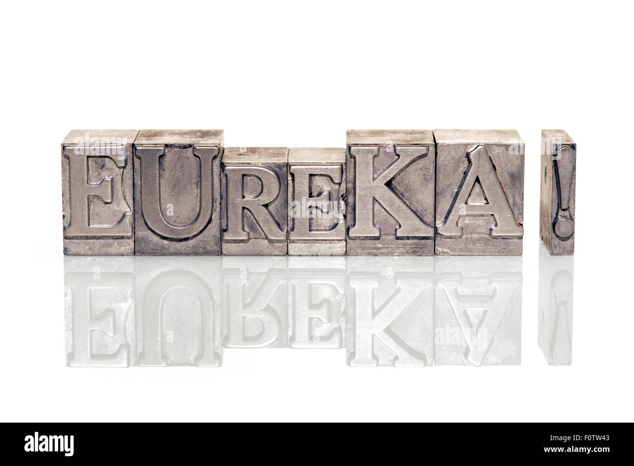 eureka exclamation made from metallic letterpress type on reflective ...