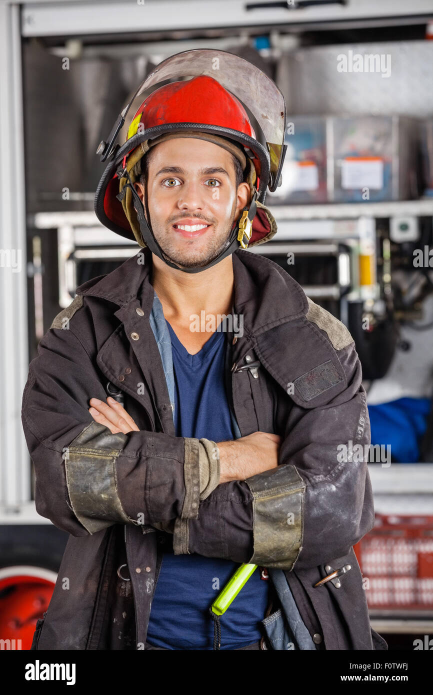 Smiling Firefighter Standing Arms Crossed Stock Photo - Alamy