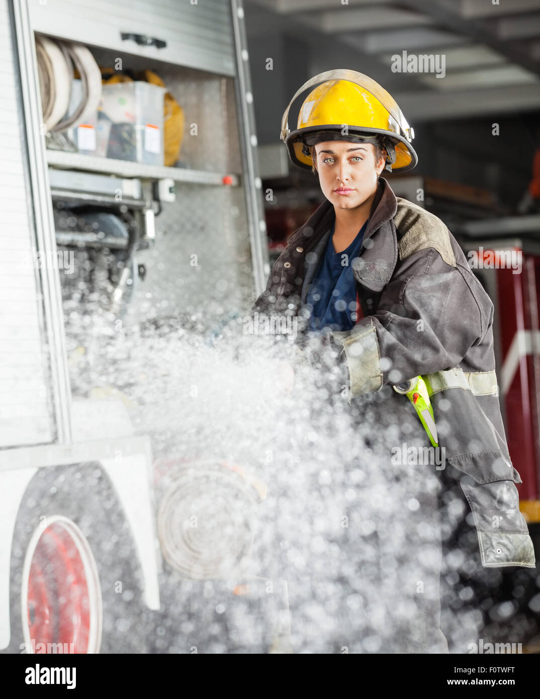Firewoman hose hi-res stock photography and images - Alamy