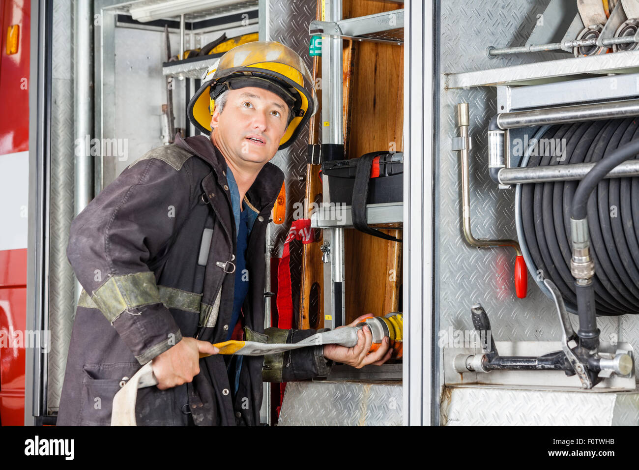 Firefighter hose pipe hi-res stock photography and images - Alamy