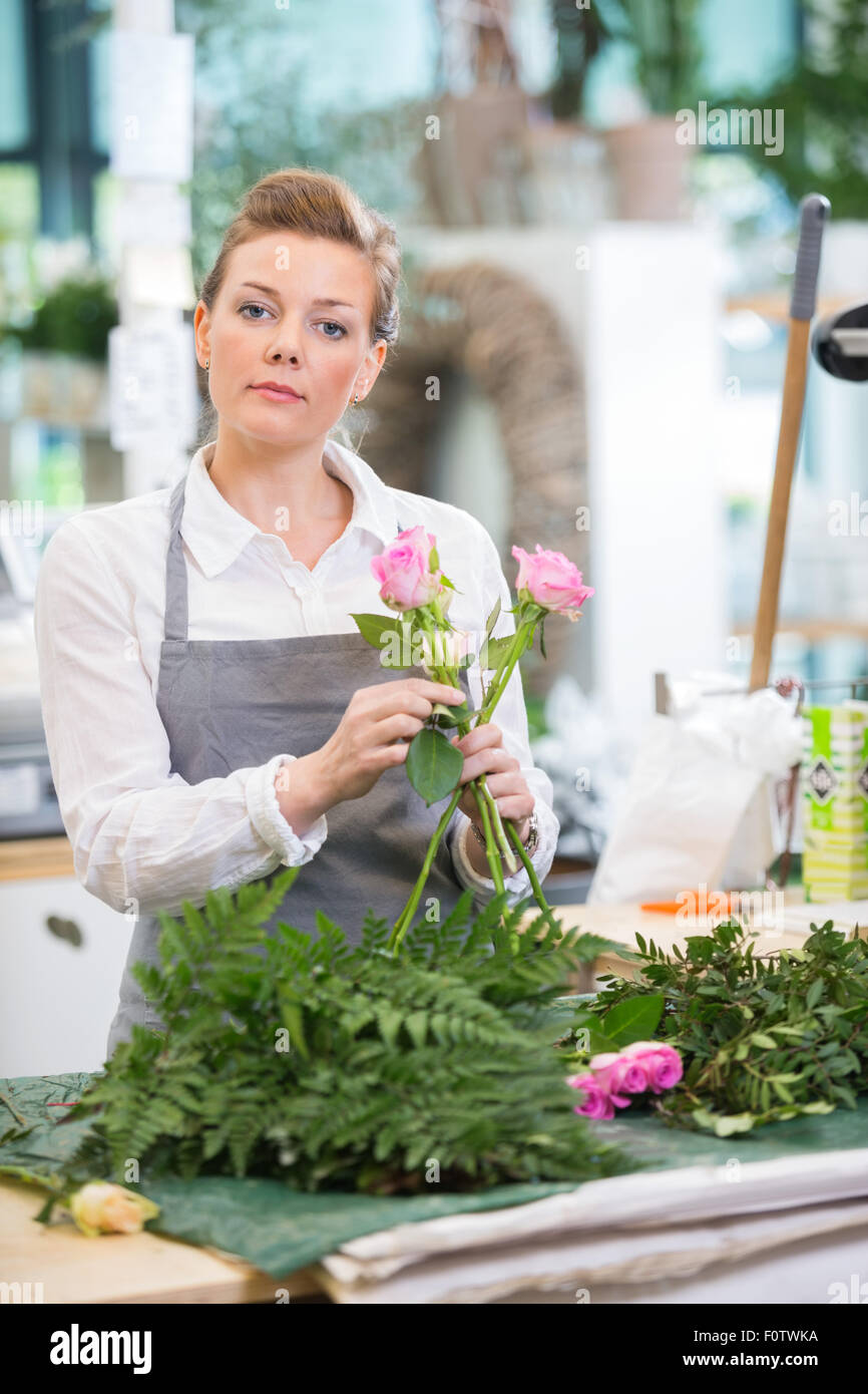 Woman florist making beautiful flower hi-res stock photography and ...