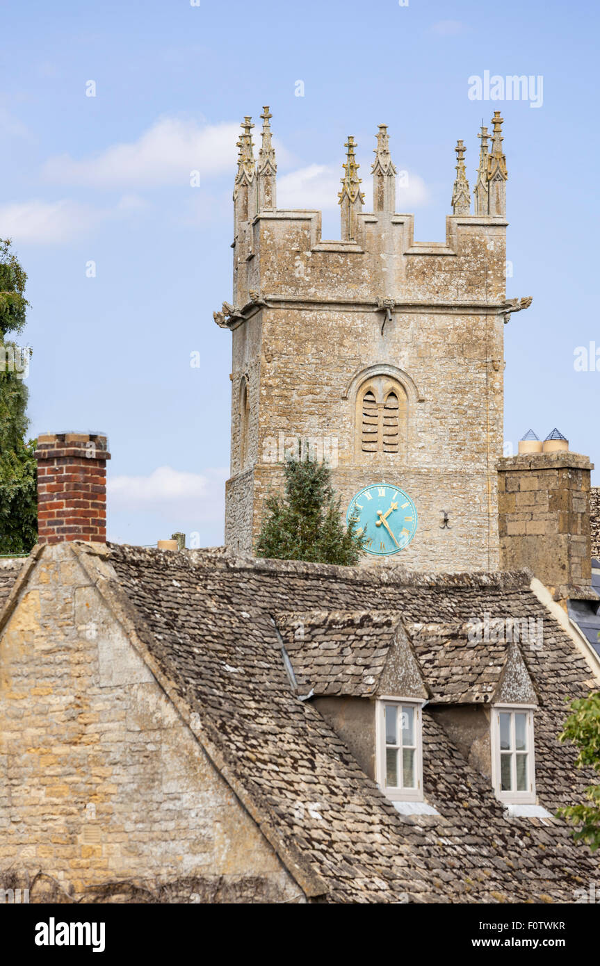 St James Church tower rises above attractive Cotswold cottages in ...