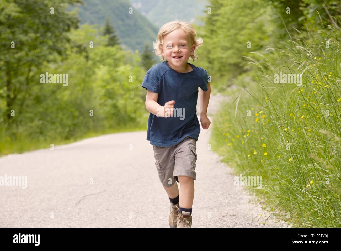 Boy running away hi-res stock photography and images - Alamy