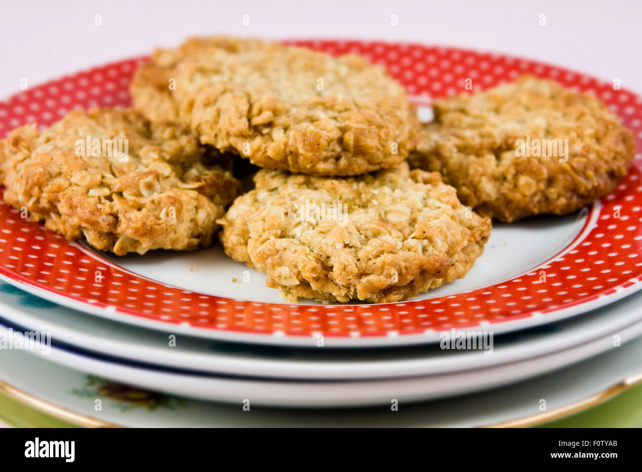 Home made oat cookies on pile of plates Stock Photo - Alamy