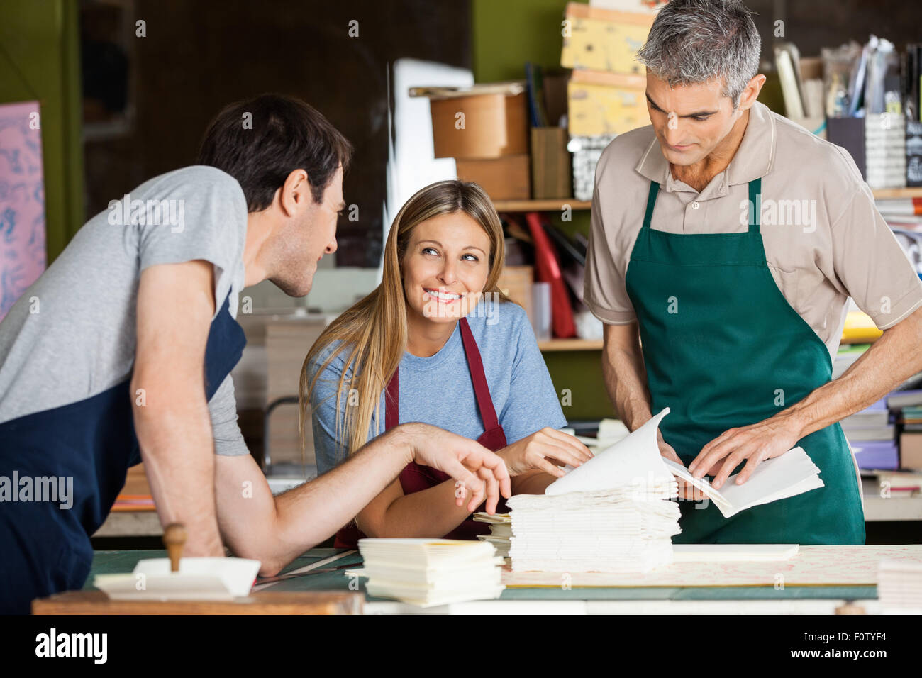 Happy Workers Working Together In Paper Factory Stock Photo - Alamy