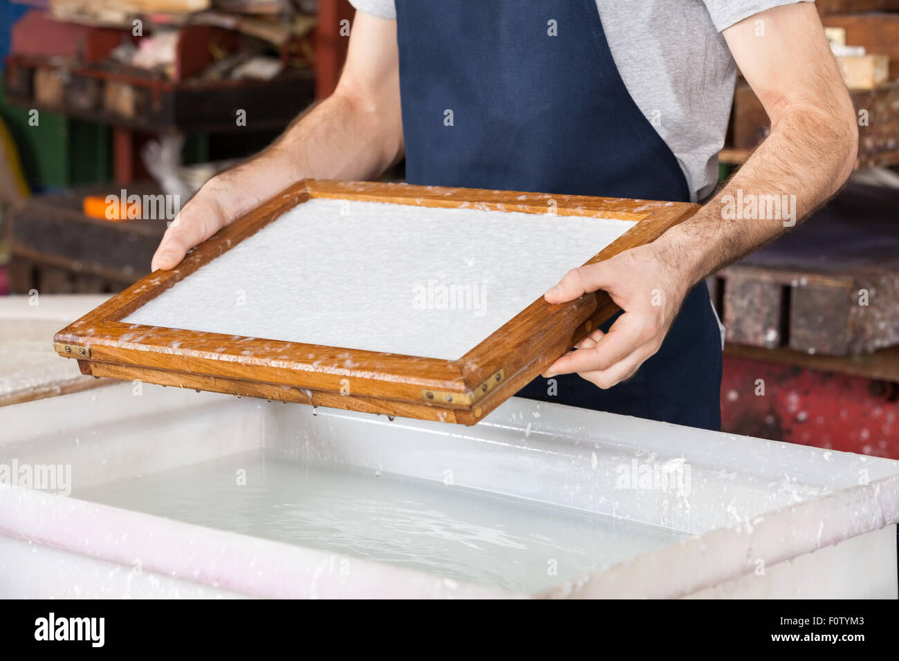 Worker Holding Mold At Paper Factory Stock Photo - Alamy