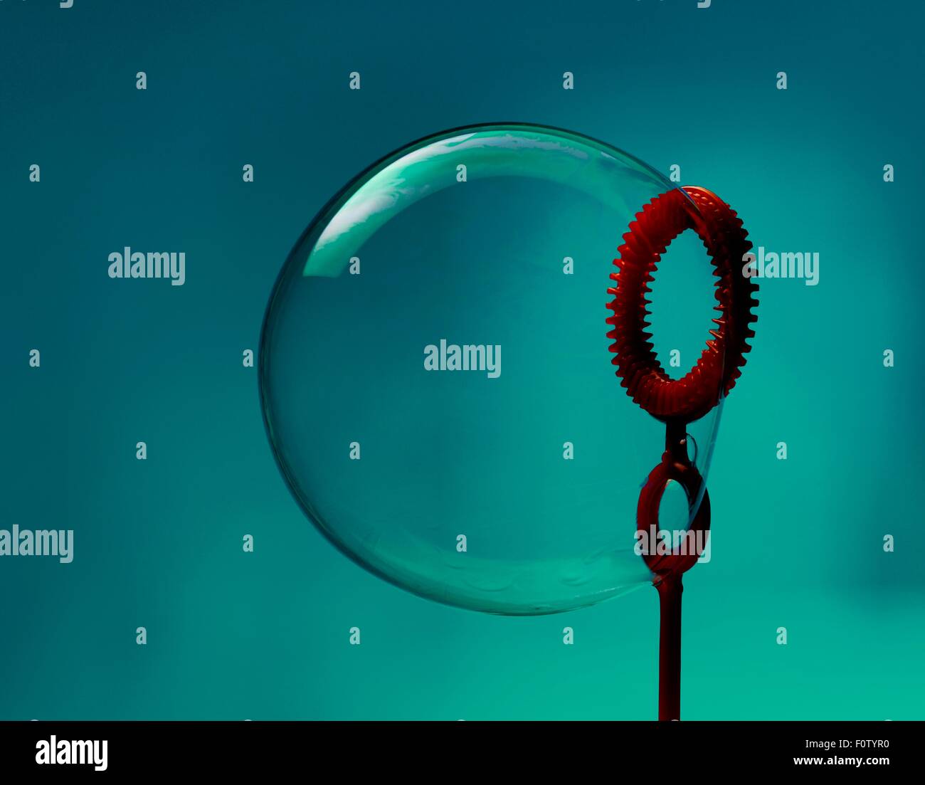 Still life of bubble and red bubble wand Stock Photo - Alamy
