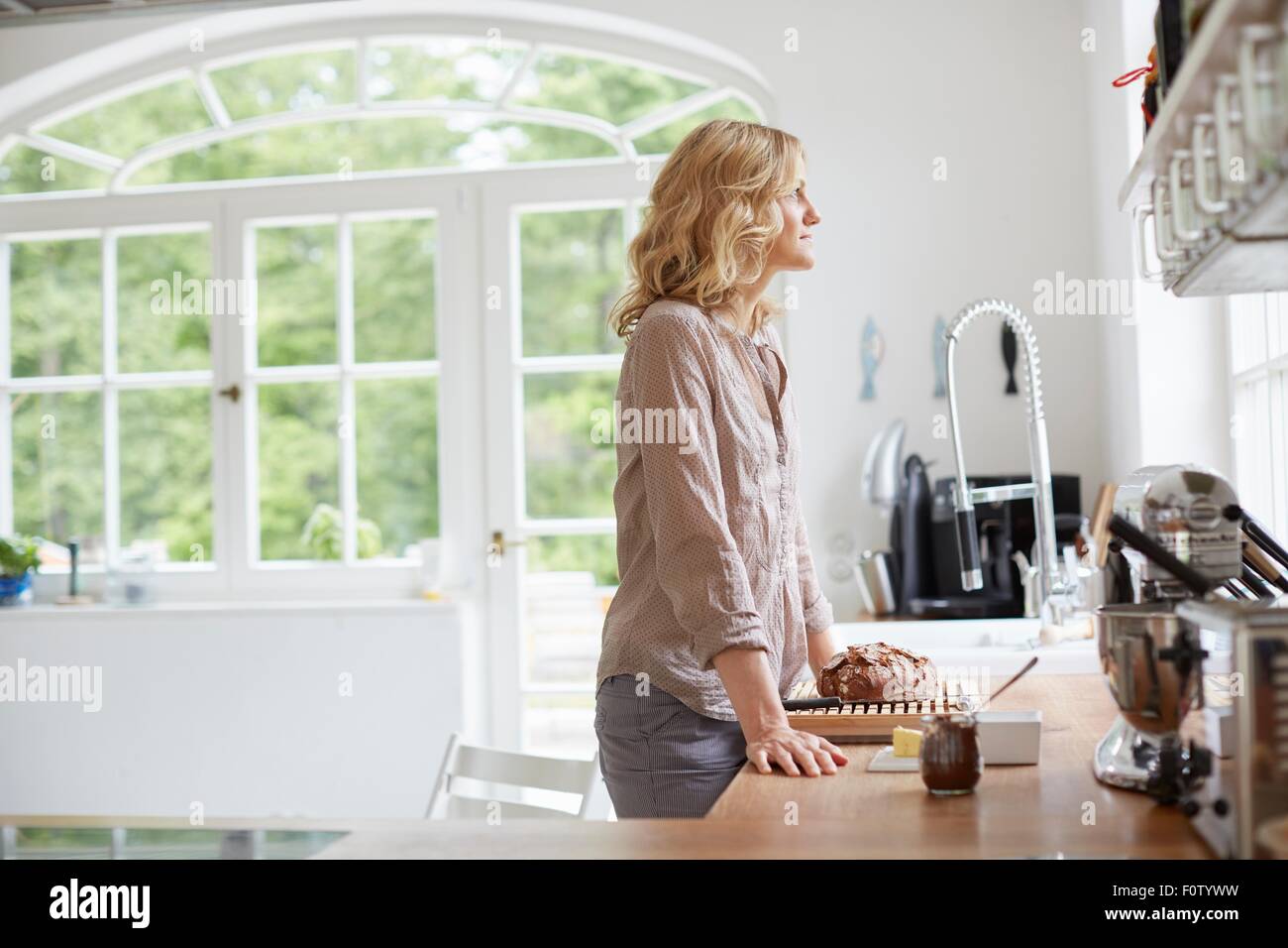 Leaning out the house window hi-res stock photography and images - Alamy