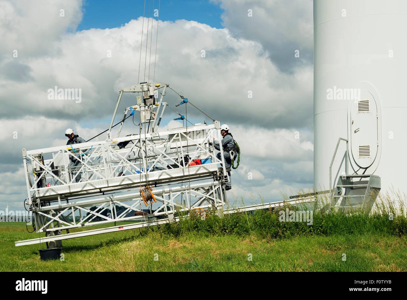 Man climbing wind turbine hi-res stock photography and images - Alamy