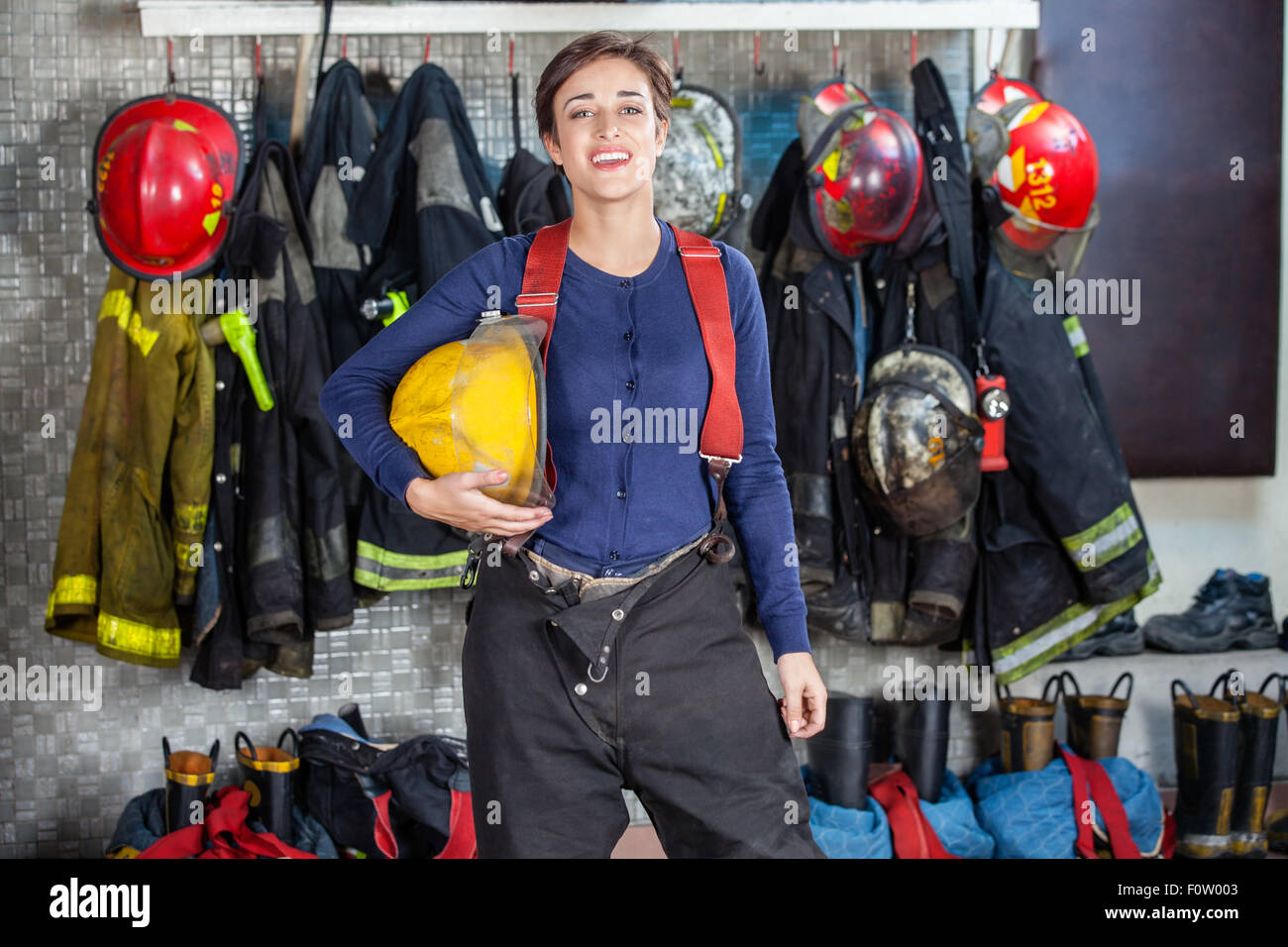 Confident Female Firefighter Standing At Fire Station Stock Photo - Alamy