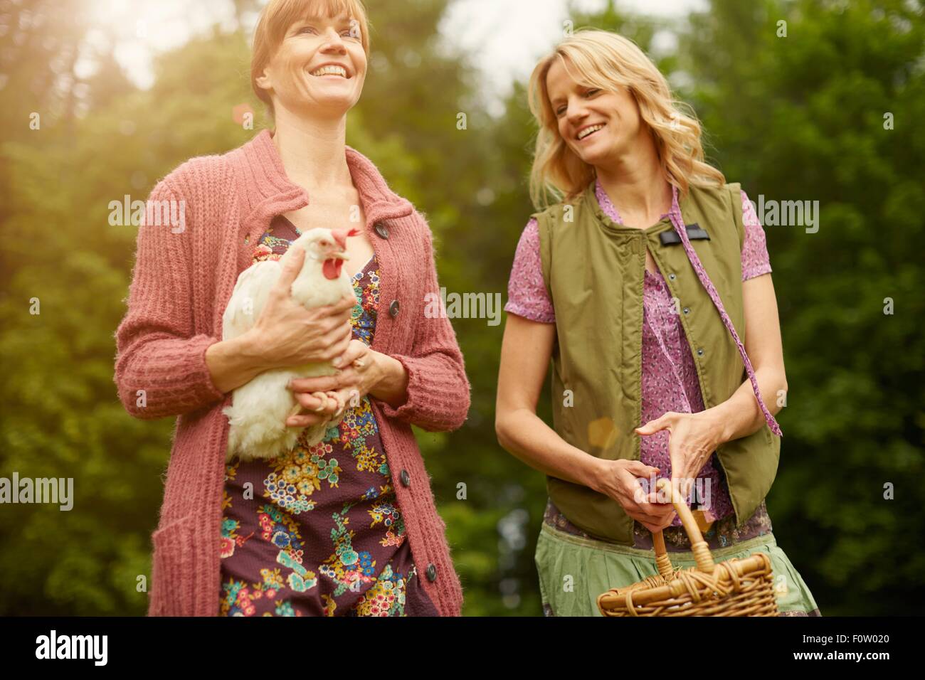 Girl carrying hen hi-res stock photography and images - Alamy