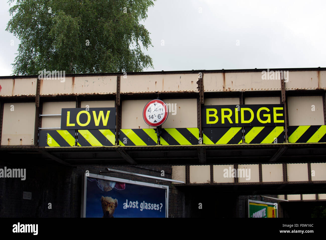 Low Bridge with chevrons and height limit, Solihull, UK Stock Photo - Alamy