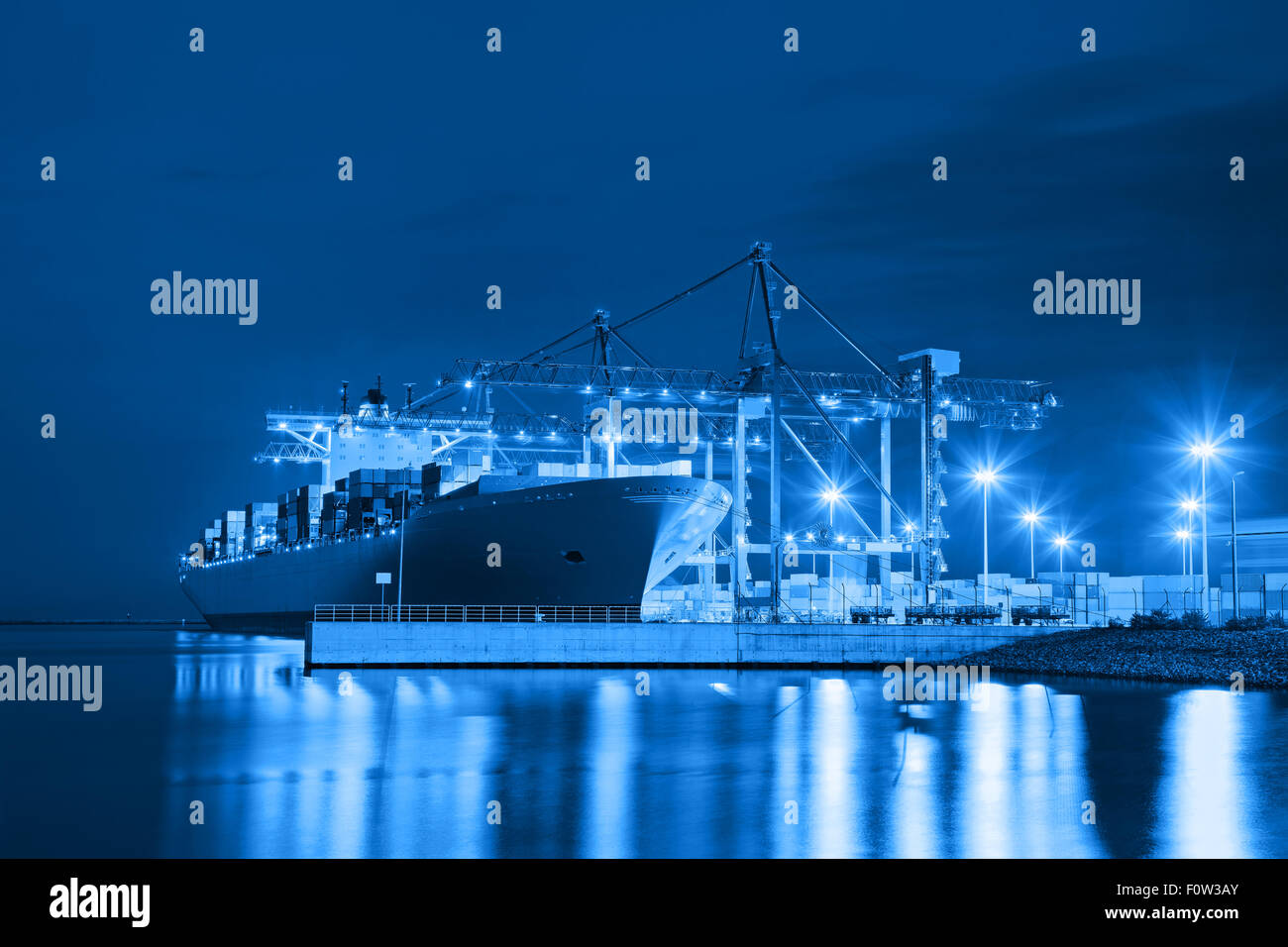 Container ship in port at night - Shipping concept Stock Photo - Alamy