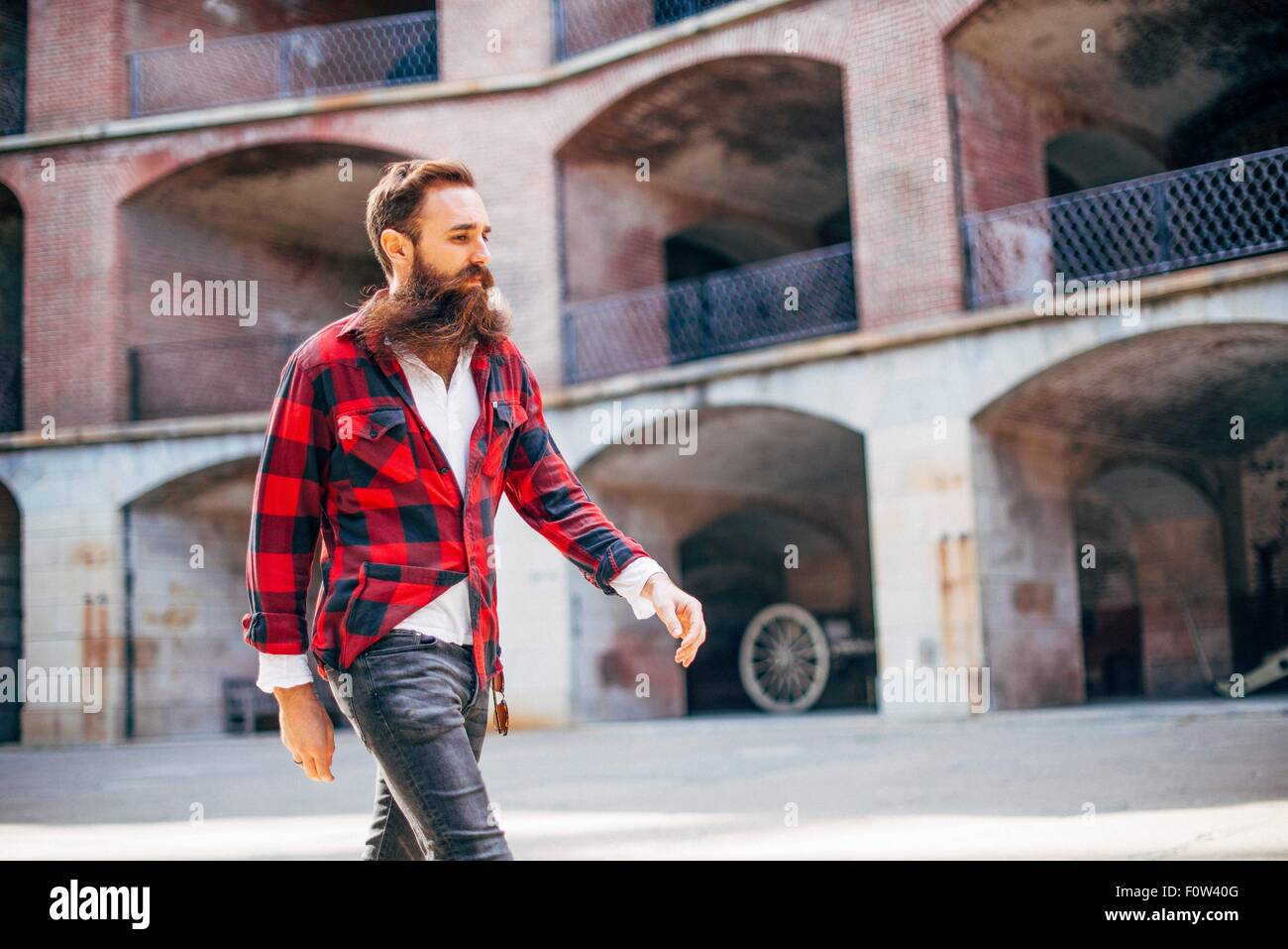 Man with beard walking Stock Photo - Alamy