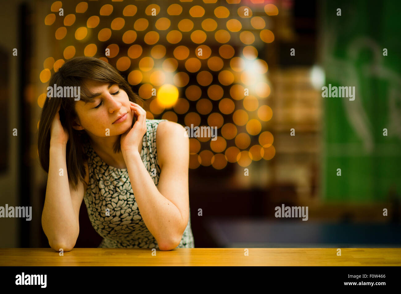 Daydreaming: A young woman with her eyes closed thinking dreaming ...