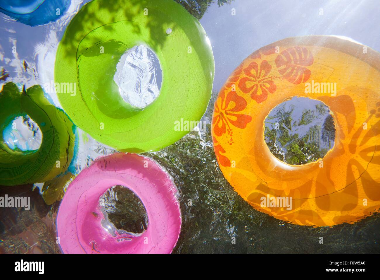Underwater shot of inflatable rings in swimming pool Stock Photo - Alamy