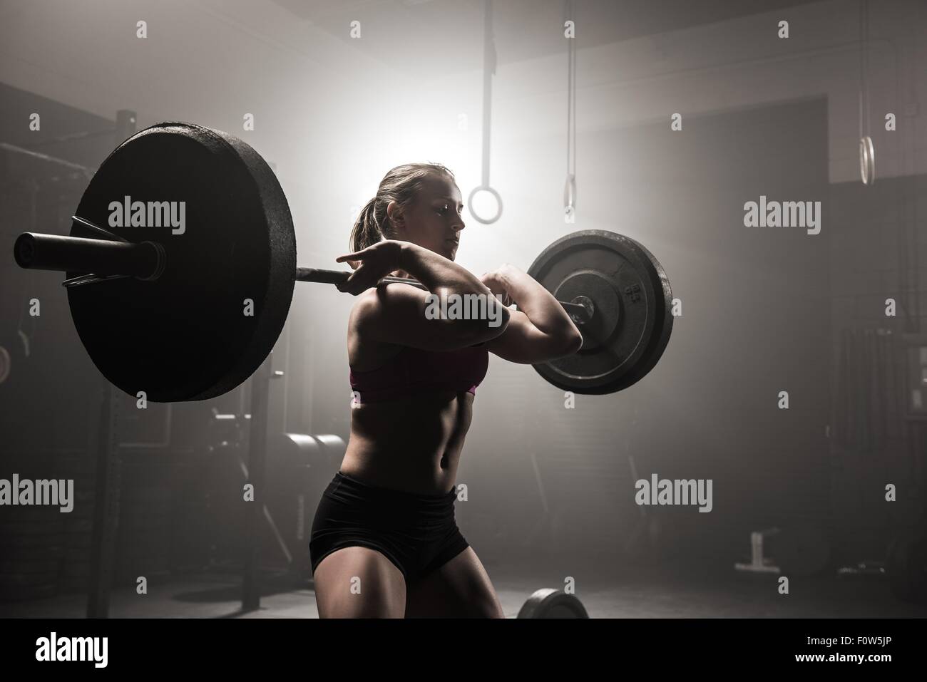 Woman weightlifting hi-res stock photography and images - Alamy