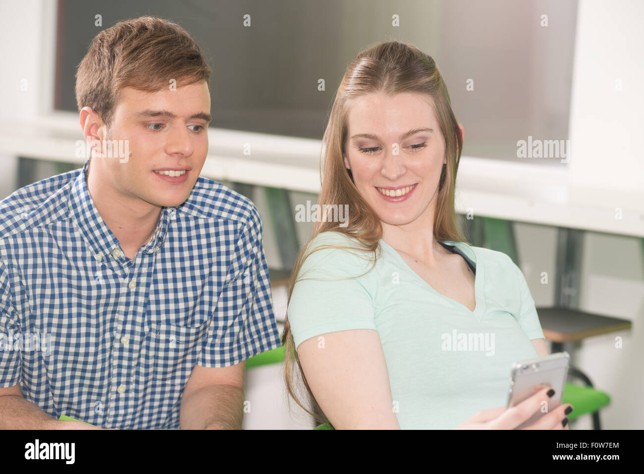 Couple studying at college Stock Photo - Alamy