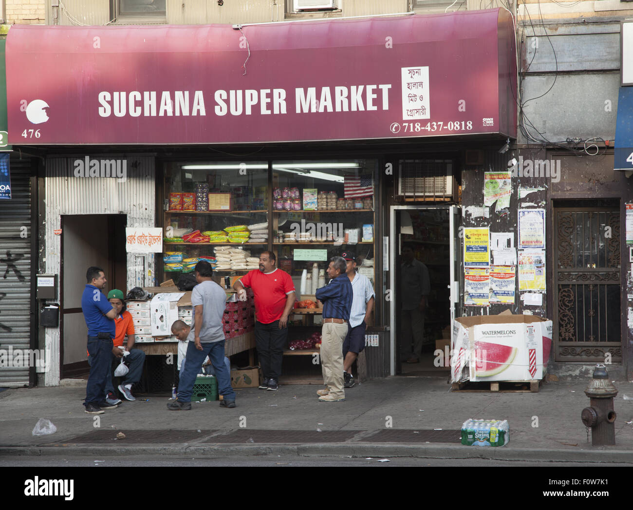 Undocumented day workers wait at a pickup site in hopes of getting a ...