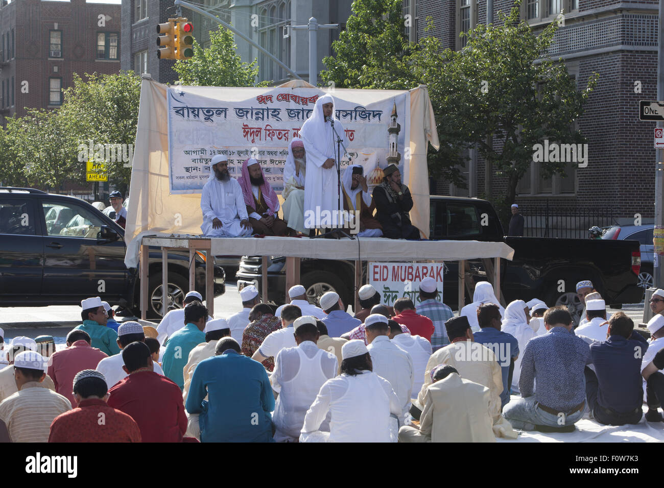 Imam leads Muslims in prayer outside a mosque in Kensington, Brooklyn ...